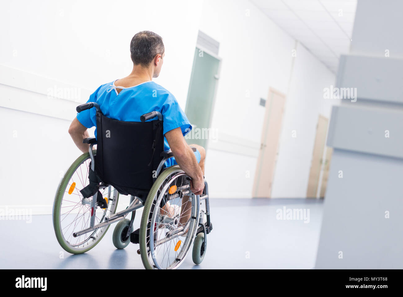 back view of male patient in wheelchair in hospital Stock Photo - Alamy