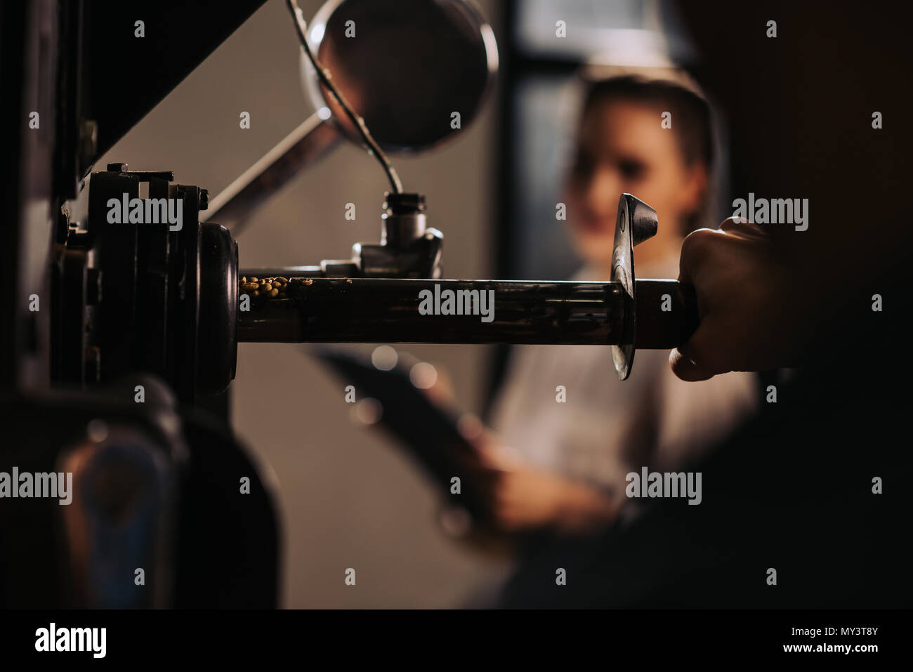 selective focus of coffee roaster operating coffee roasting machine ...