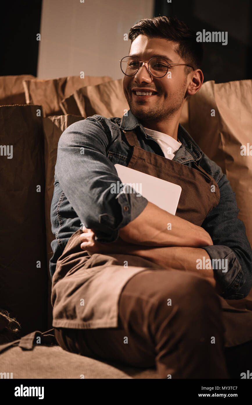 Sitting on sack hi-res stock photography and images - Alamy