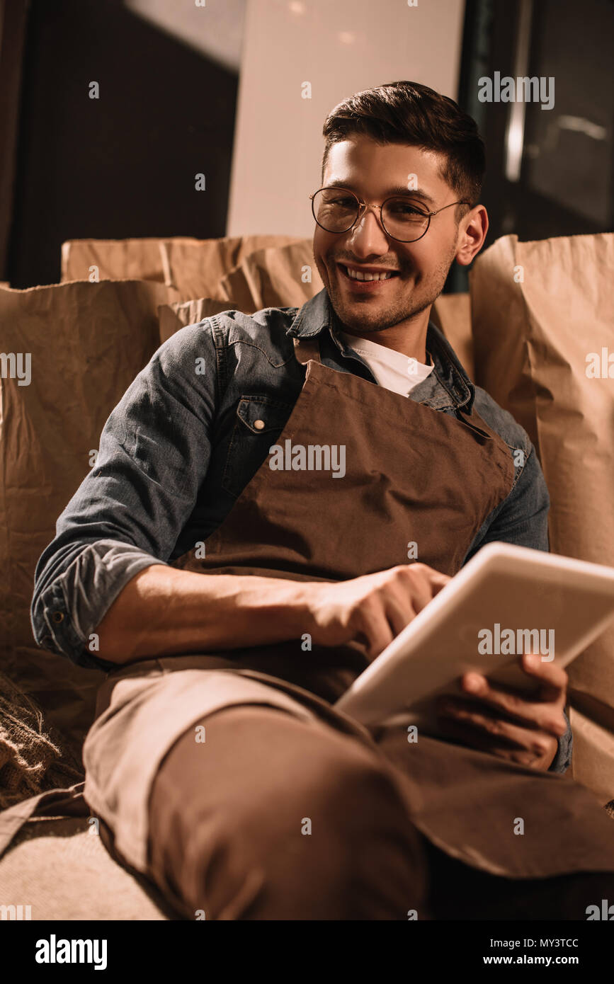 Sitting on sack hi-res stock photography and images - Alamy