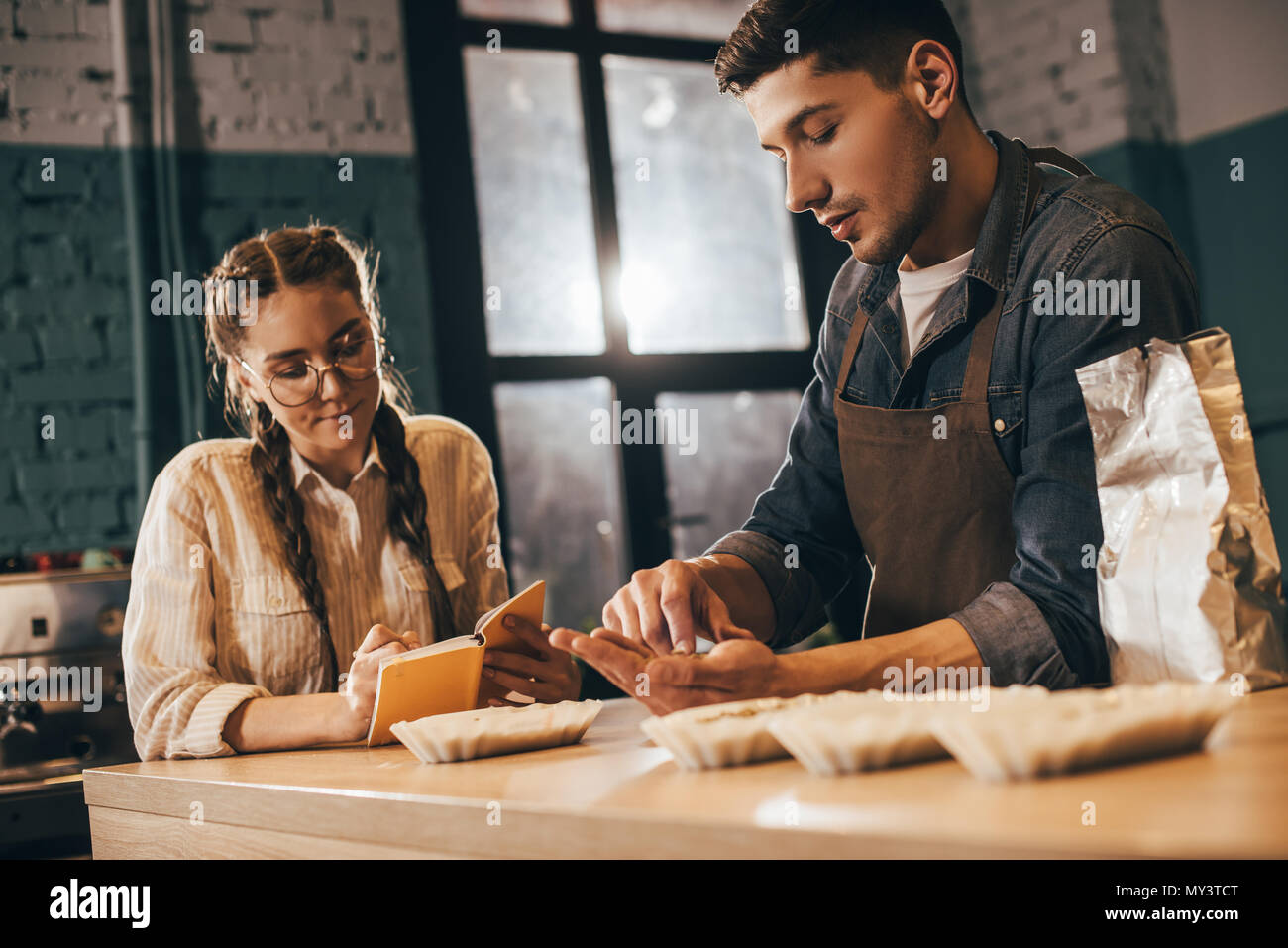 coffee shop workers checking coffee quality during coffee food function ...