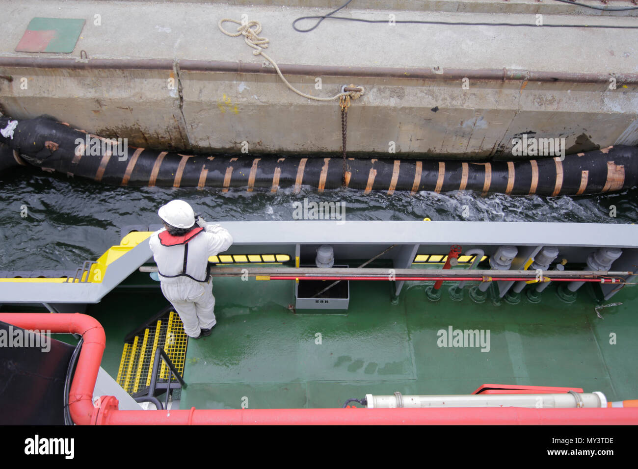 CONSTANTA, ROMANIA - MAY 19, 2018: Sailor aboard a tug boat at sea ...