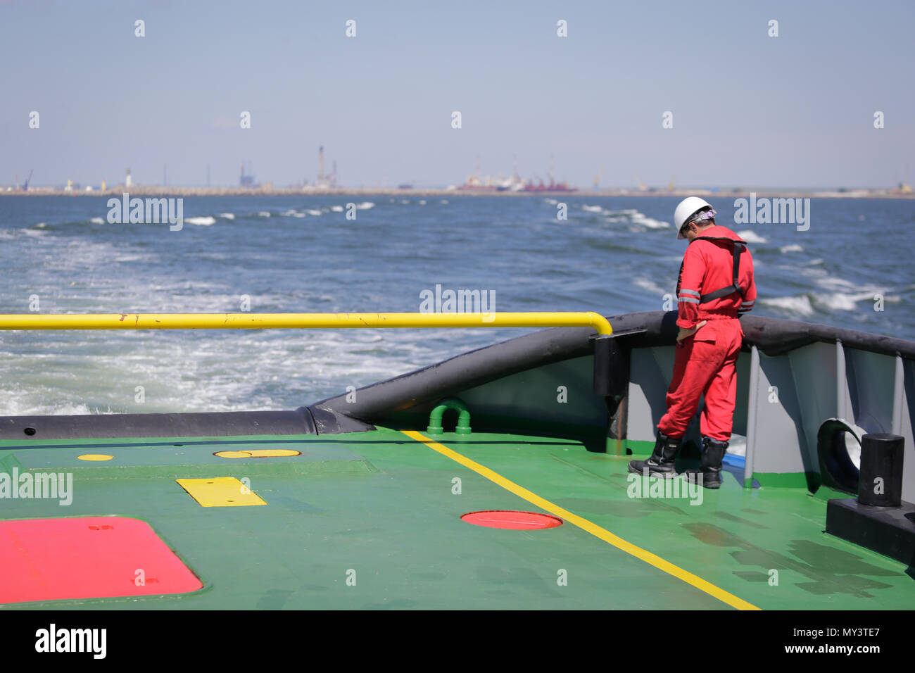 CONSTANTA, ROMANIA - MAY 19, 2018: Sailor aboard a tug boat at sea ...