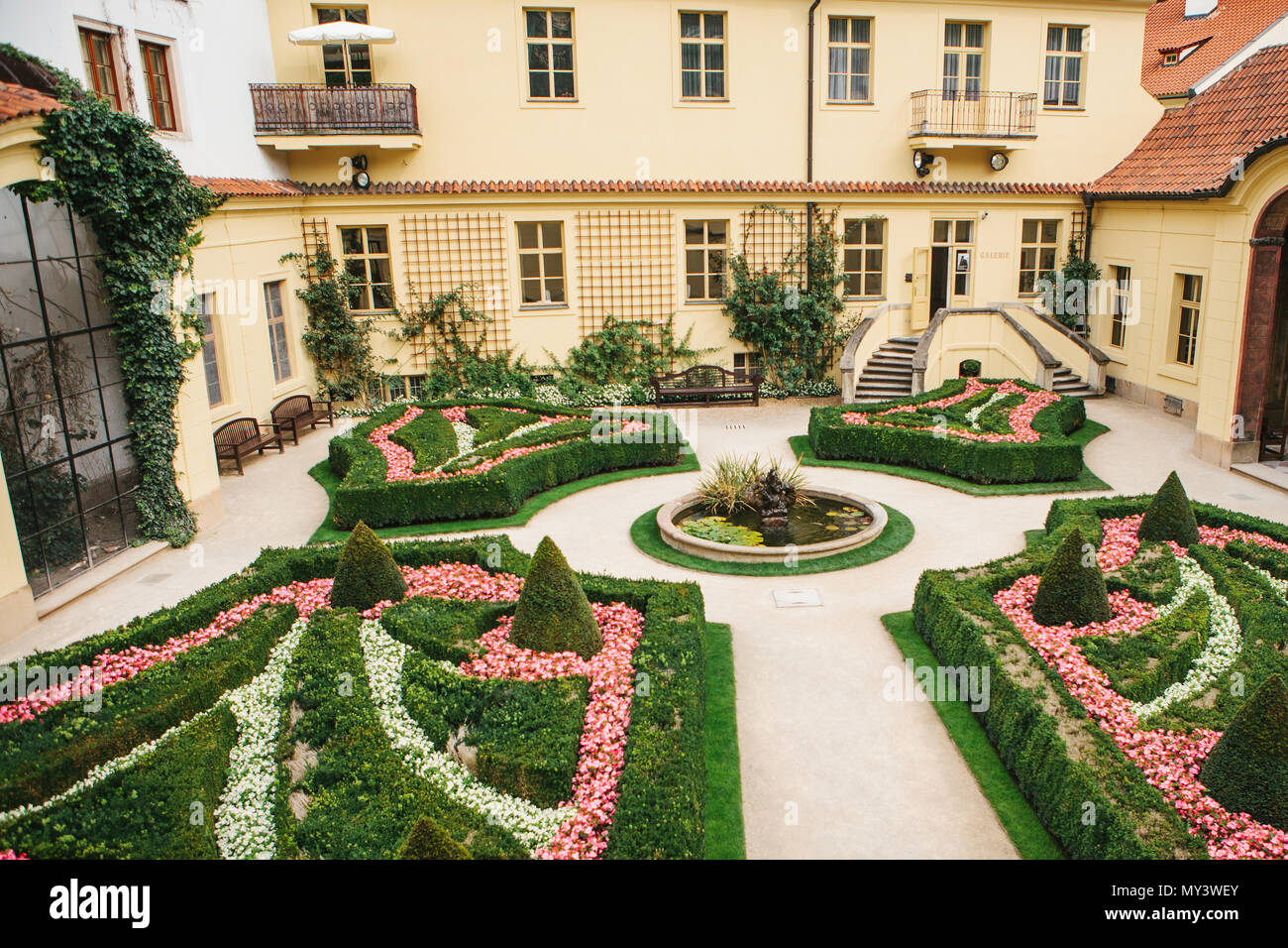 Prague, September 18, 2017: A beautiful alley with fountains and plants ...