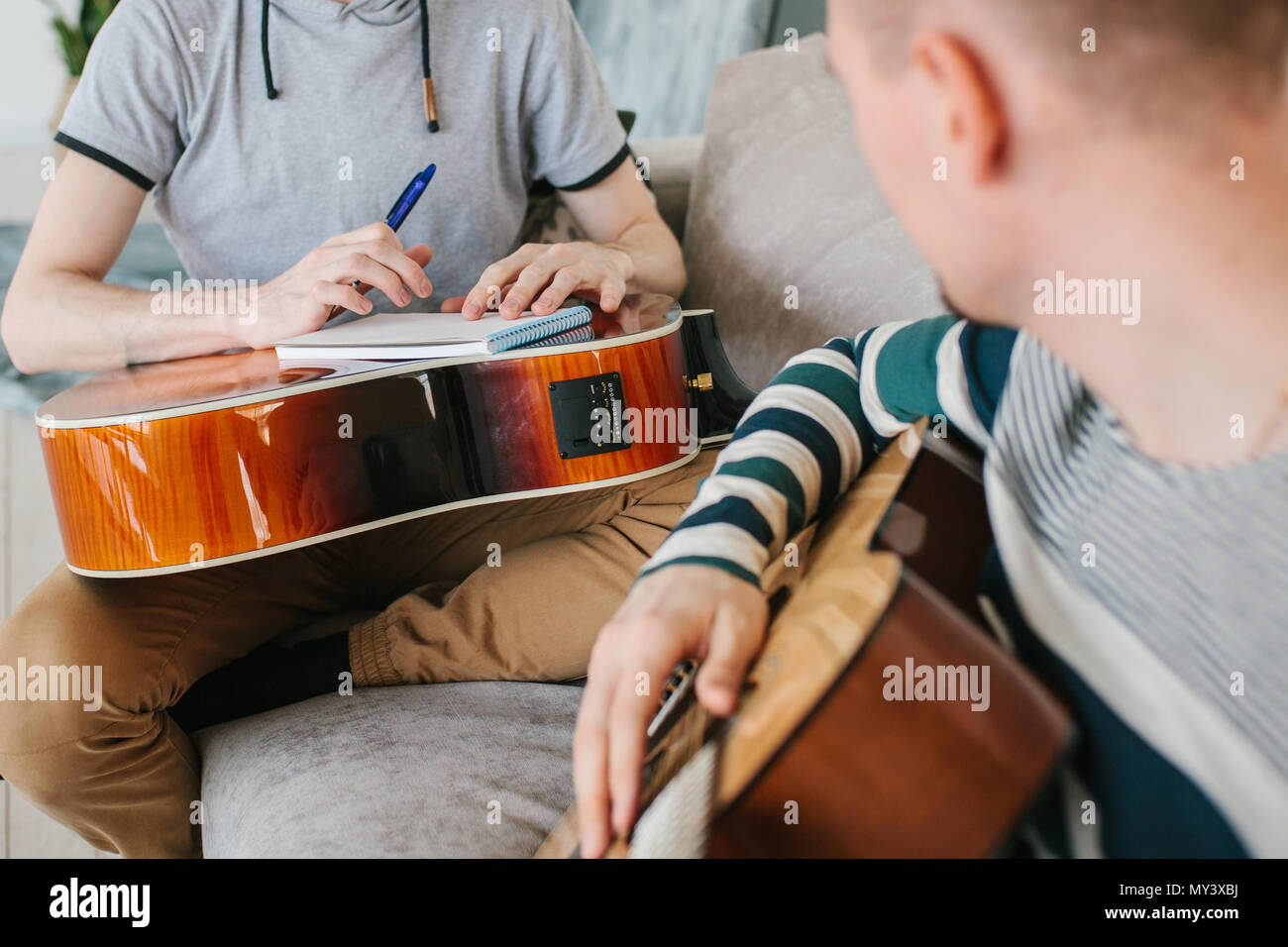 Learning to play the guitar. Music education Stock Photo - Alamy
