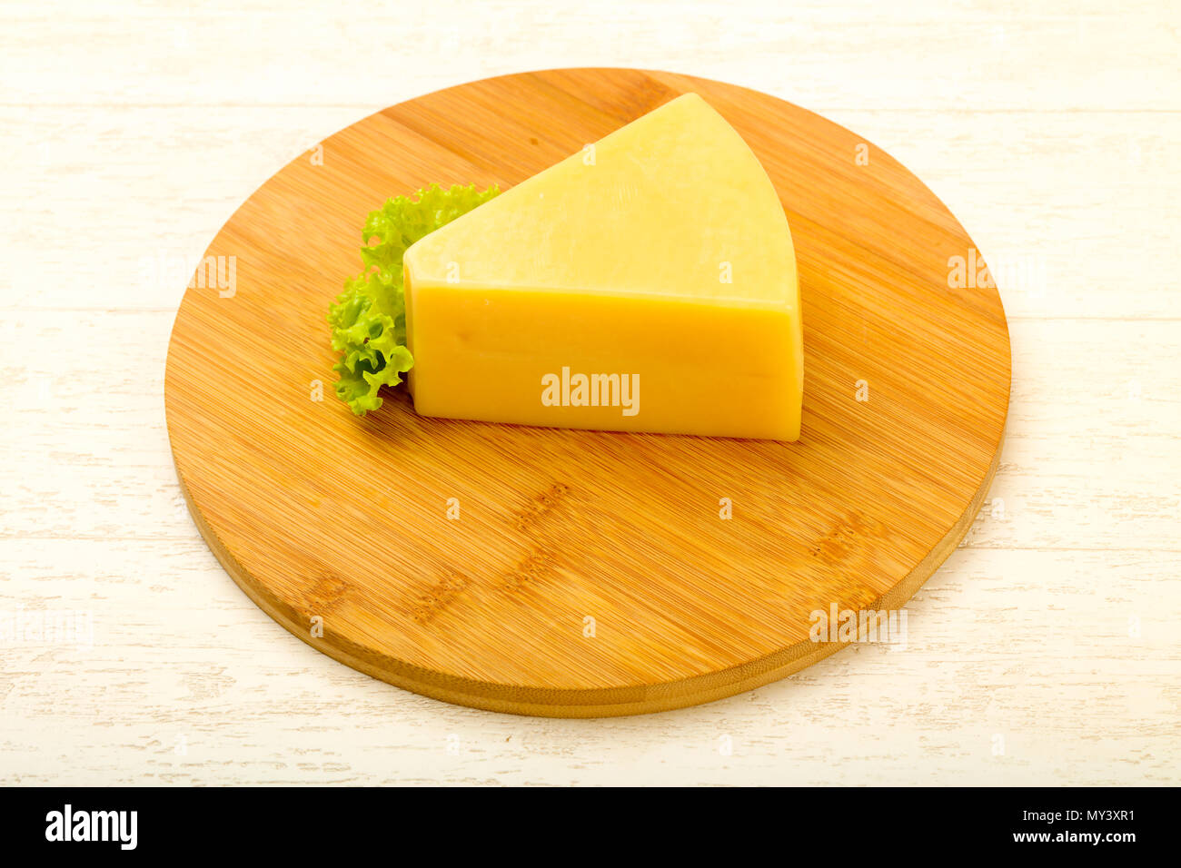 Parmesan cheese triangle Stock Photo - Alamy