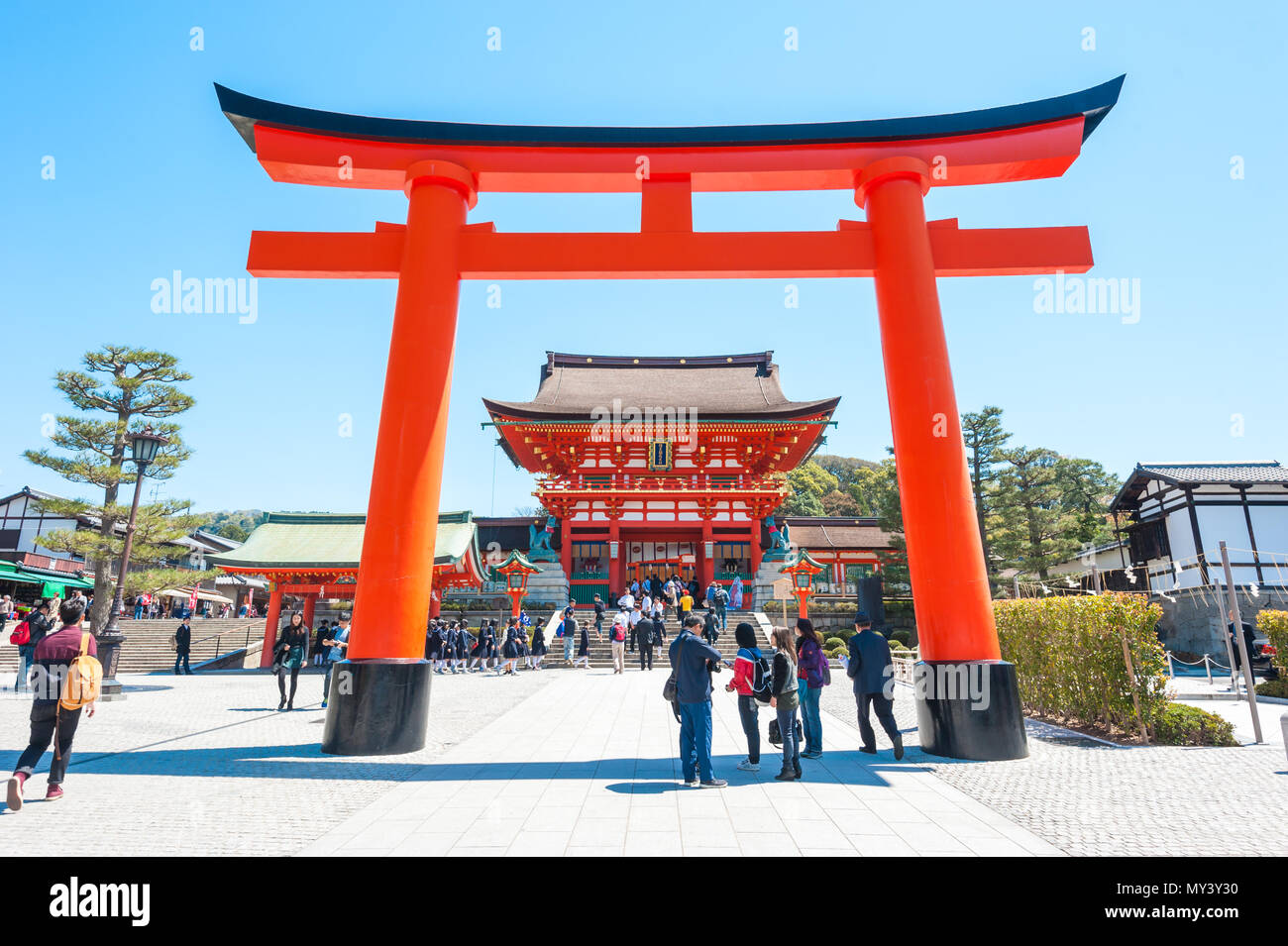 Red door named Torii in Fushimi Inari shrine, Kyoto, Japan Stock Photo ...