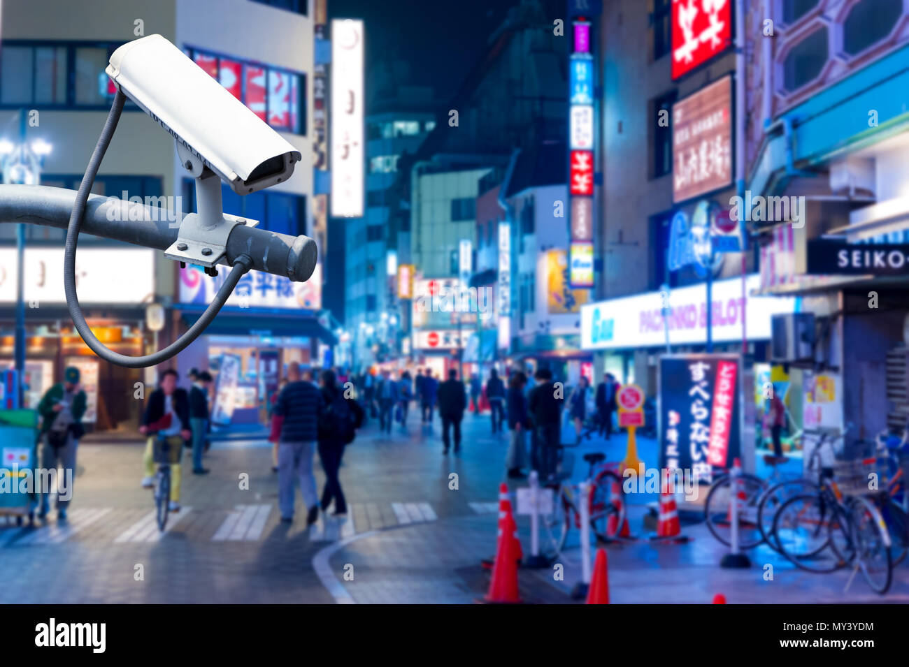 CCTV Camera or surveillance oeprating on street at night Stock Photo ...