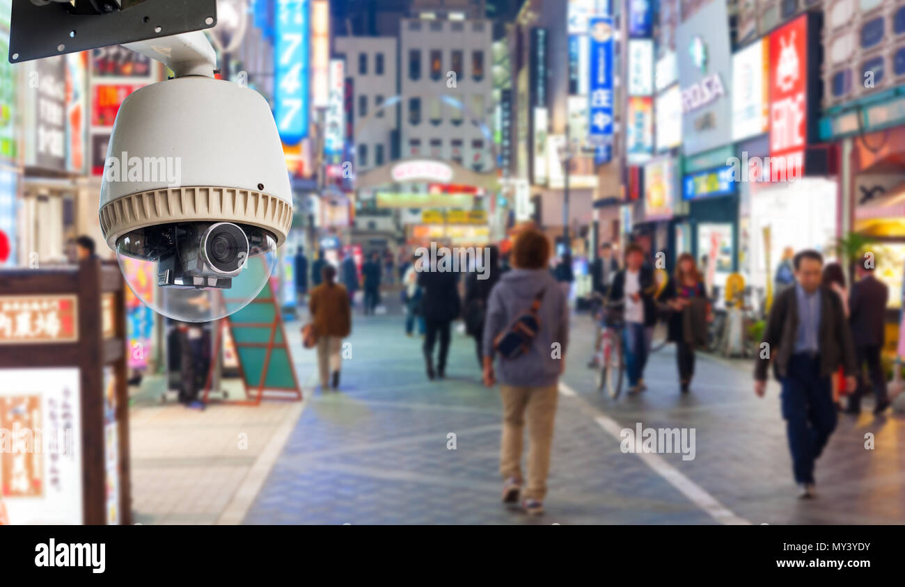 CCTV Camera or surveillance oeprating on street at night Stock Photo ...
