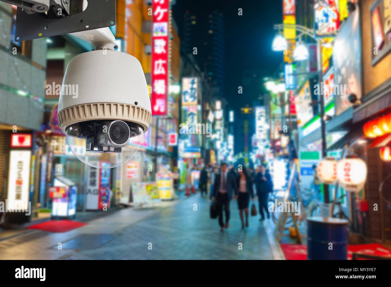 CCTV Camera or surveillance oeprating on street at night Stock Photo ...