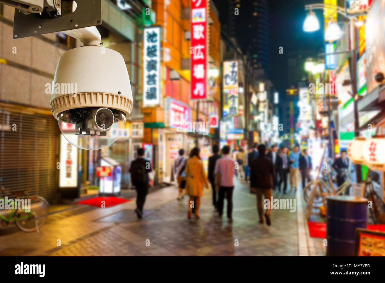 CCTV Camera or surveillance oeprating on street at night Stock Photo ...