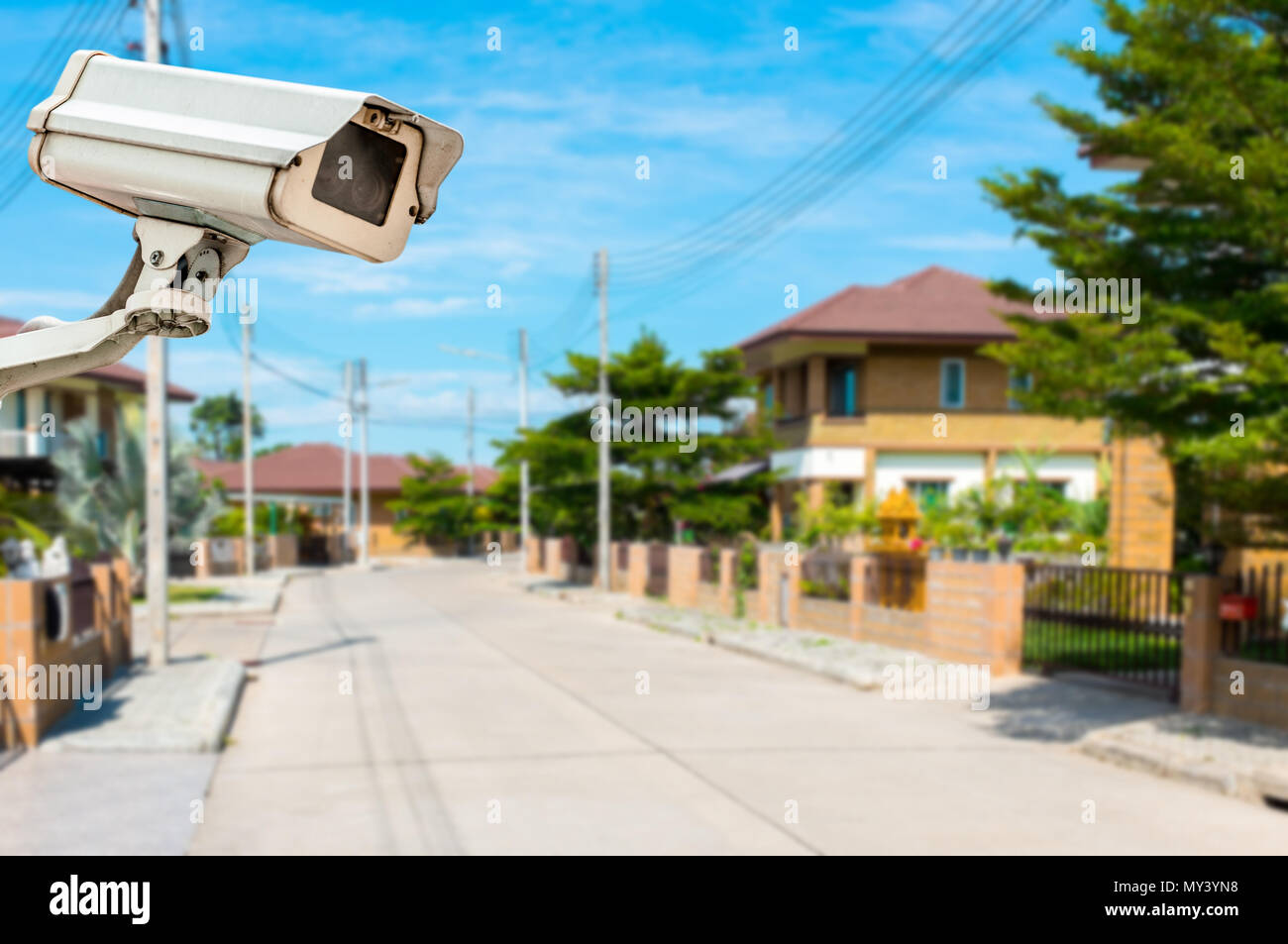 CCTV Camera with house and village in background Stock Photo - Alamy