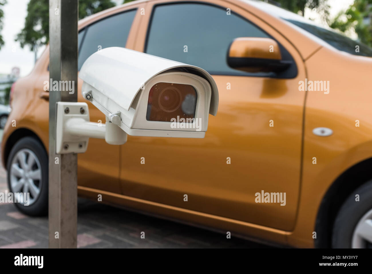 CCTV Camera or surveillance Operating in with car drive by in ...