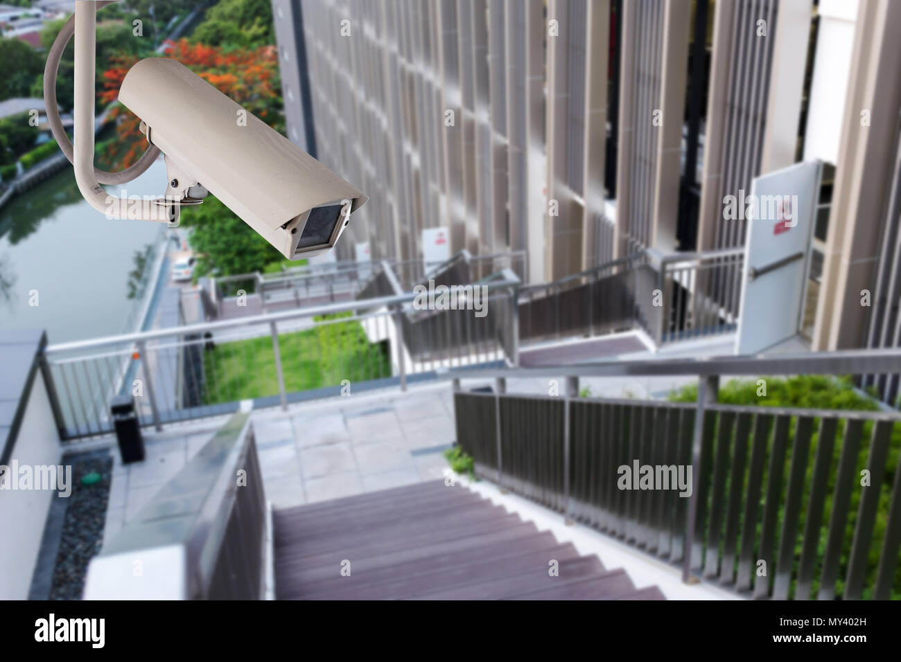 CCTV camera or surveillance operating outside door and stairway Stock ...