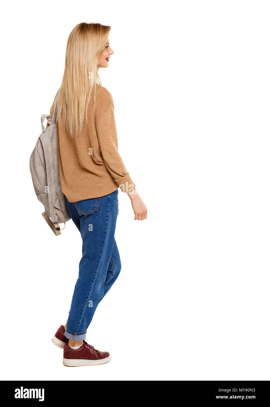 back view of walking woman with backpack. backside view of person. Rear ...