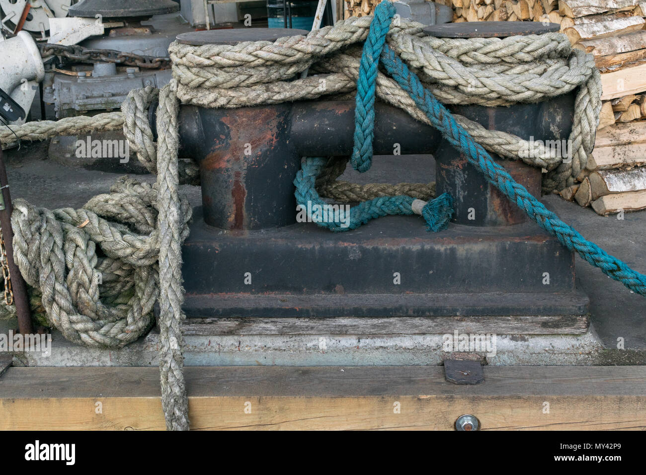 Old rope background. Big sea rope, rusty metal and firewood Stock Photo ...