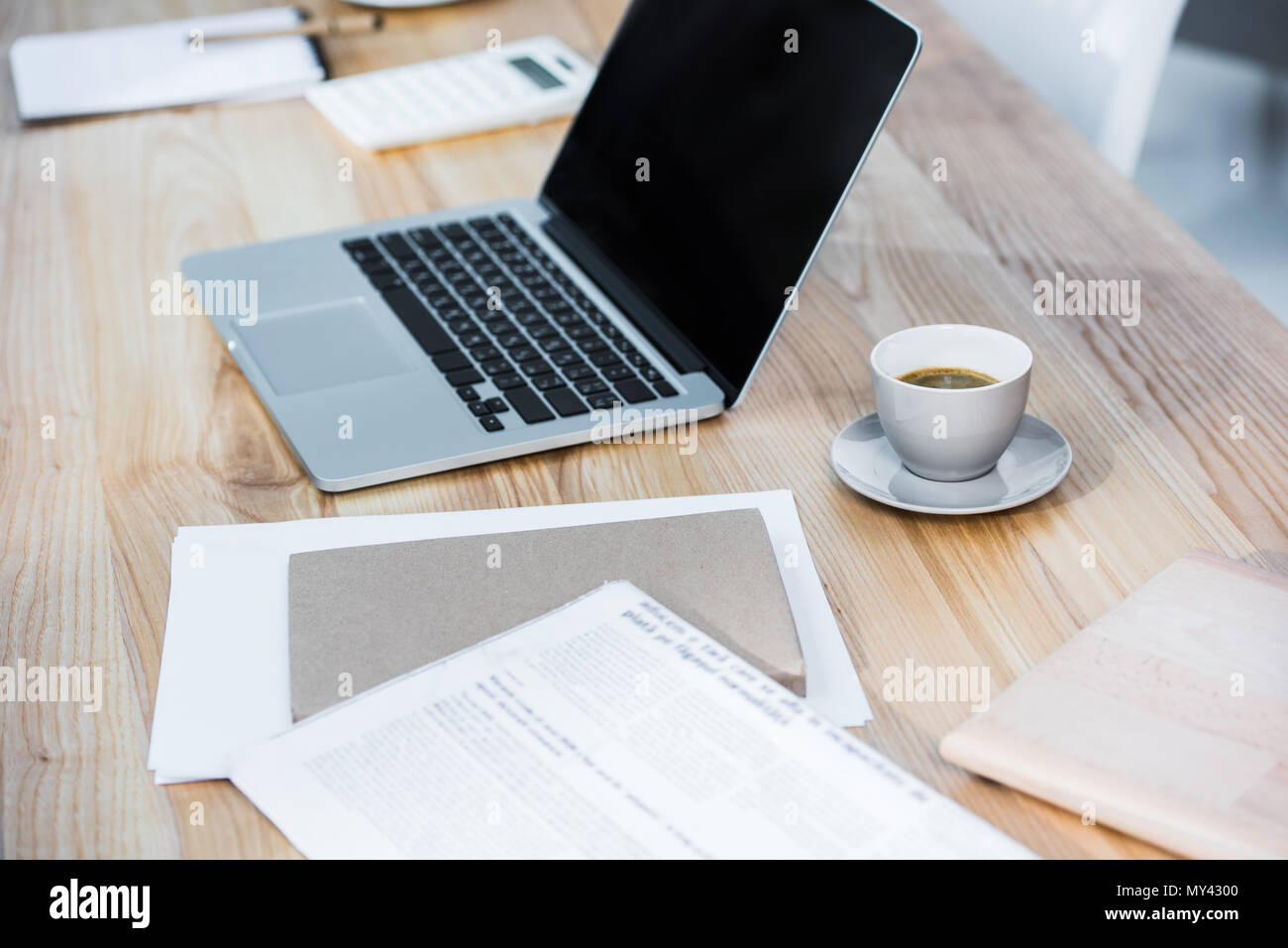 Modern office workplace with coffee and laptop computer Stock Photo - Alamy