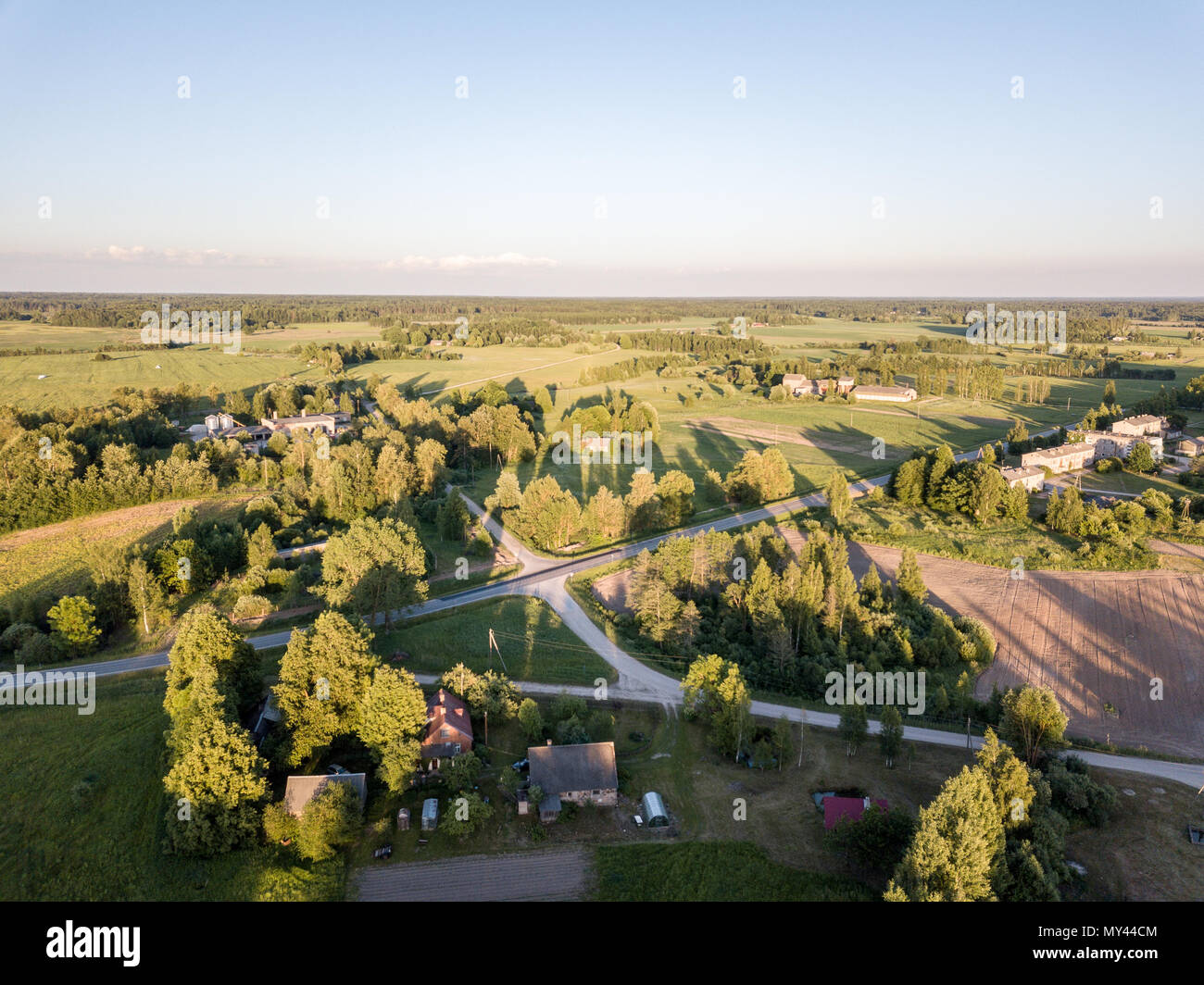 drone image. aerial view of countryside road network, cultivated fields ...