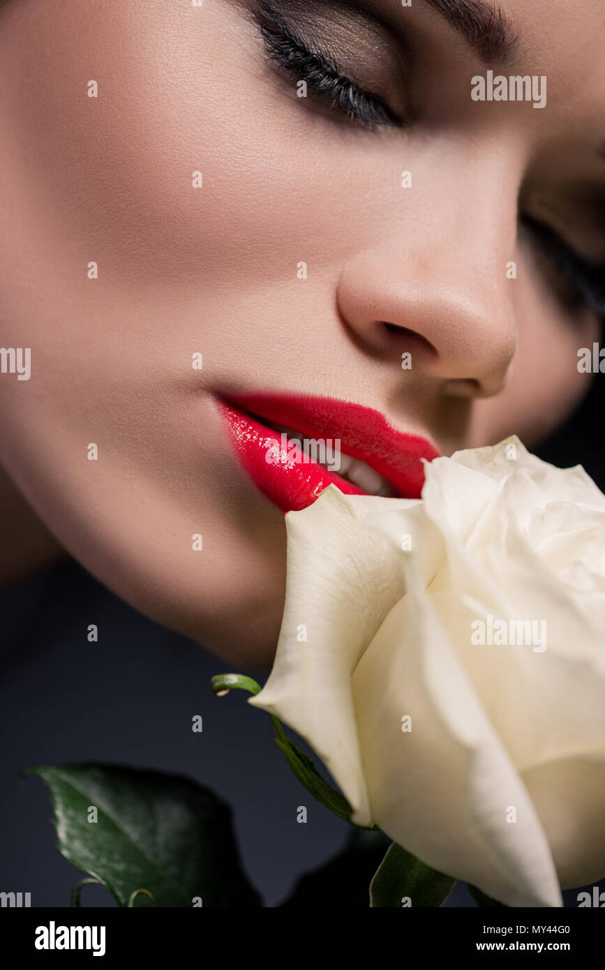 close up portrait of lady smelling white rose with eyes closed Stock ...