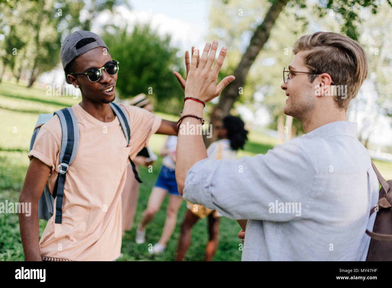 Young boys high five hi-res stock photography and images - Alamy