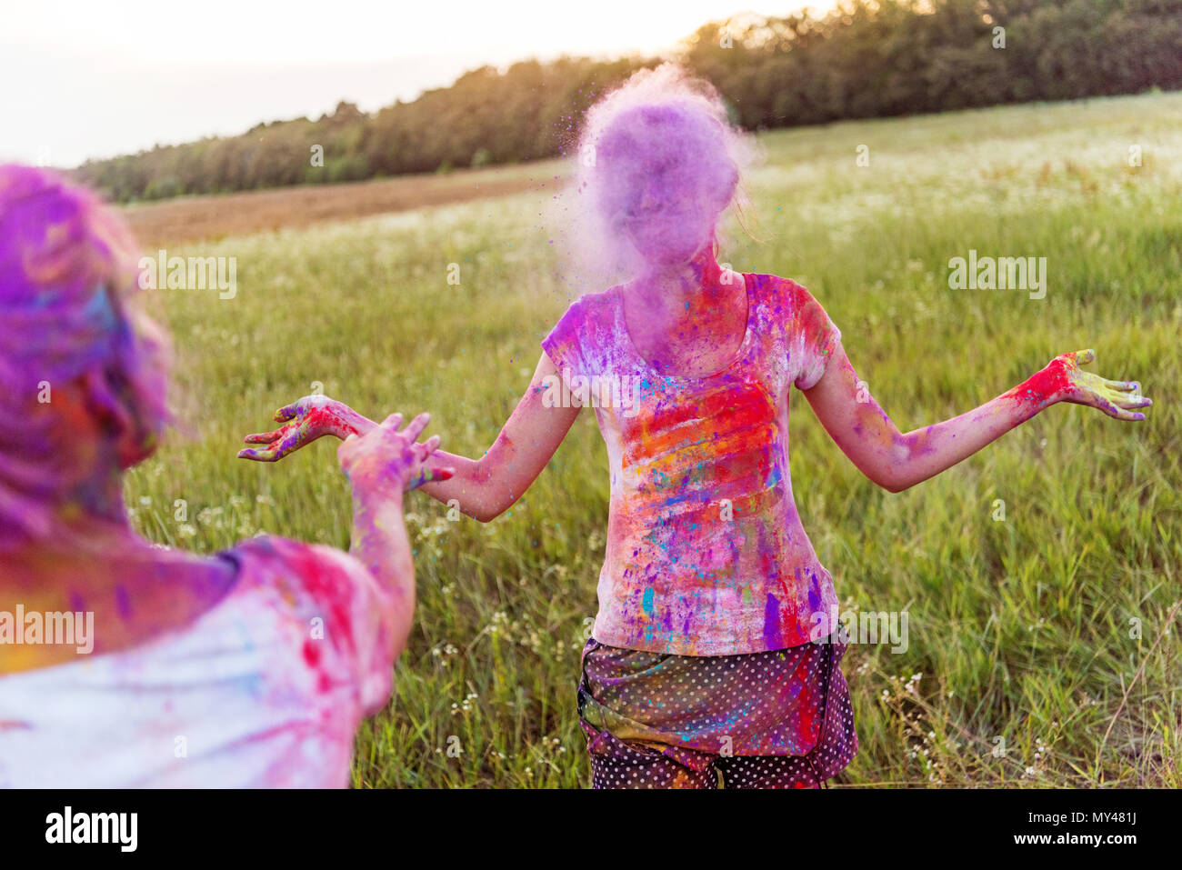 Throwing colorful powder hi-res stock photography and images - Alamy