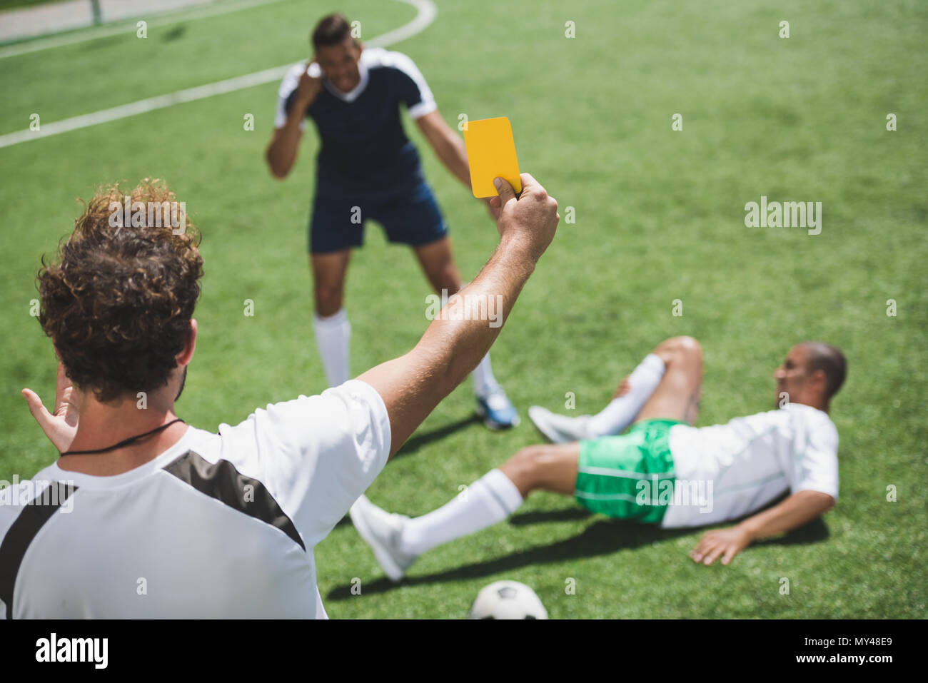 Referee showing yellow card hi-res stock photography and images - Alamy