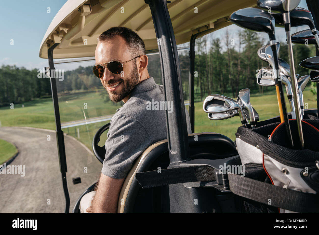 Man golf cart ride hi-res stock photography and images - Alamy