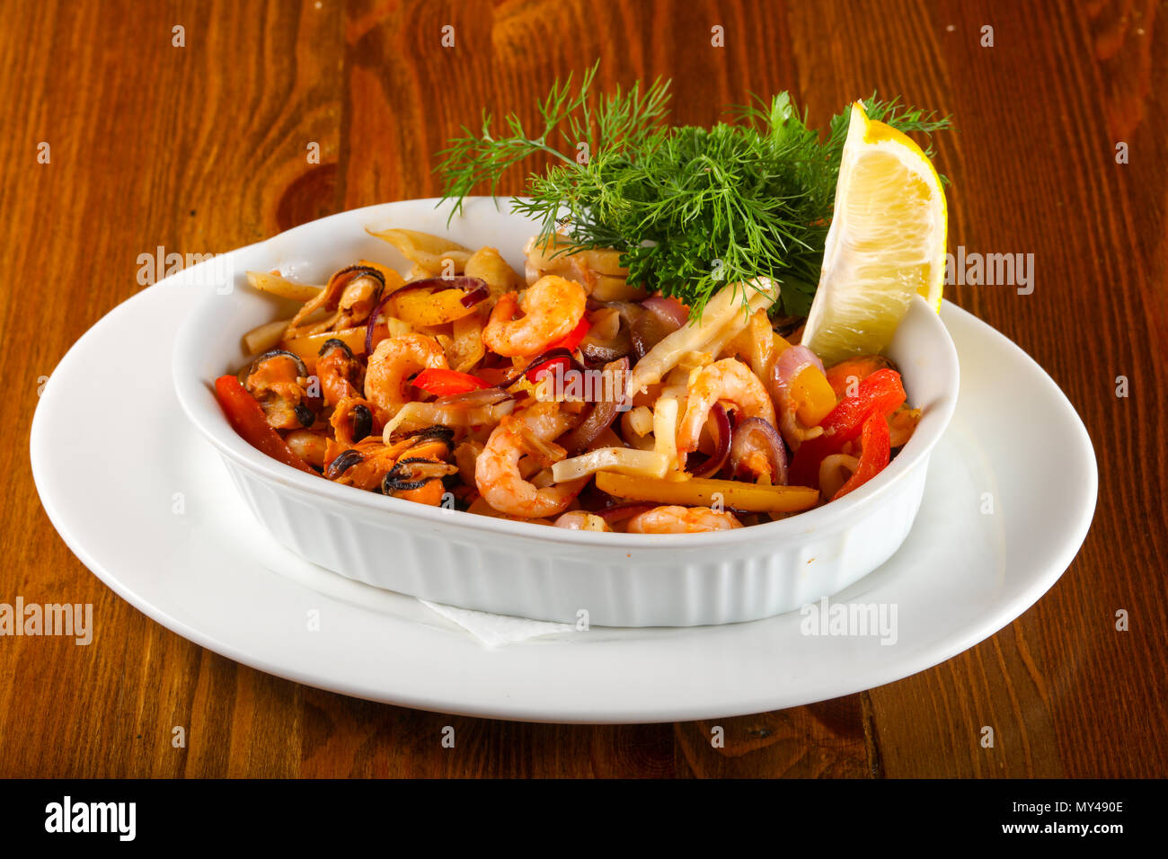 Seafood cocktail with squid, mussels and shrimps Stock Photo - Alamy