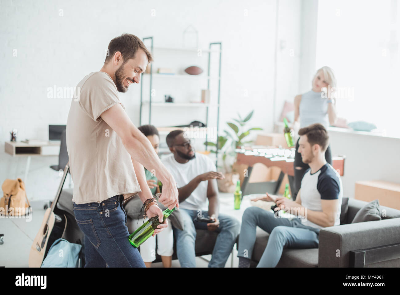 Man opening beer bottle hi-res stock photography and images - Alamy