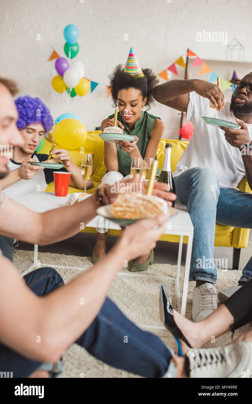Partying diverse people eating birthday cake and holding drinks Stock ...
