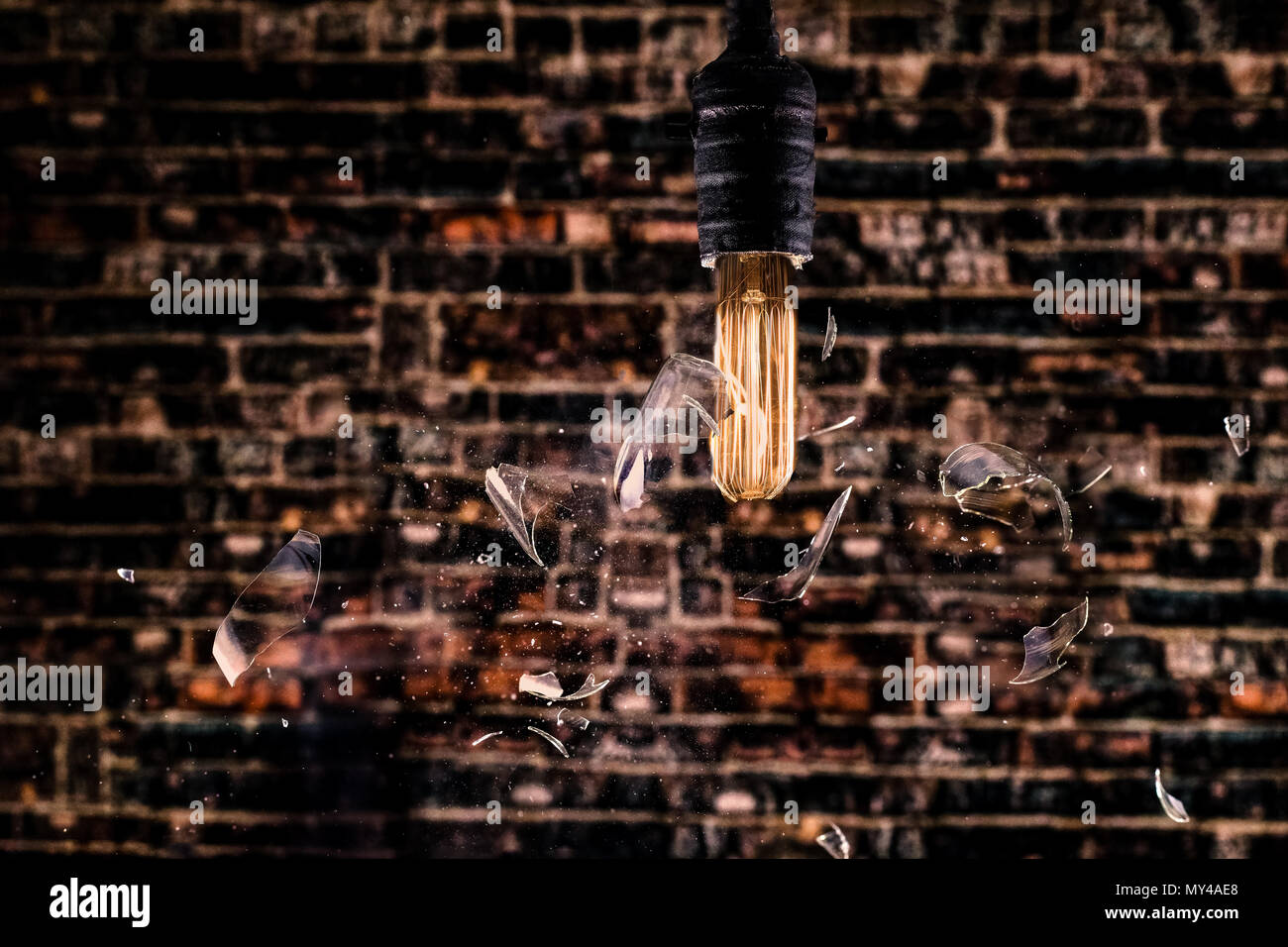 Lit Edison Bulb Shattering Prior to filament burning out Stock Photo ...