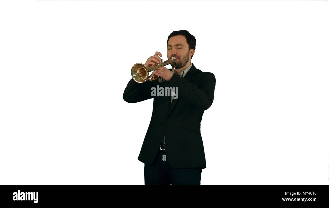 Portrait of a young man playing his Trumpet on white background ...