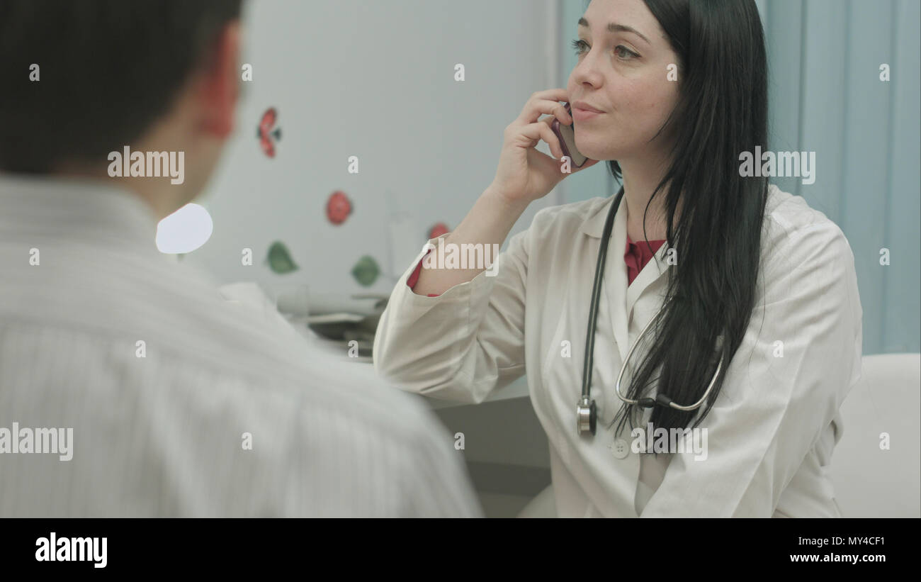 Doctor having an important phone call in medical office Stock Photo - Alamy