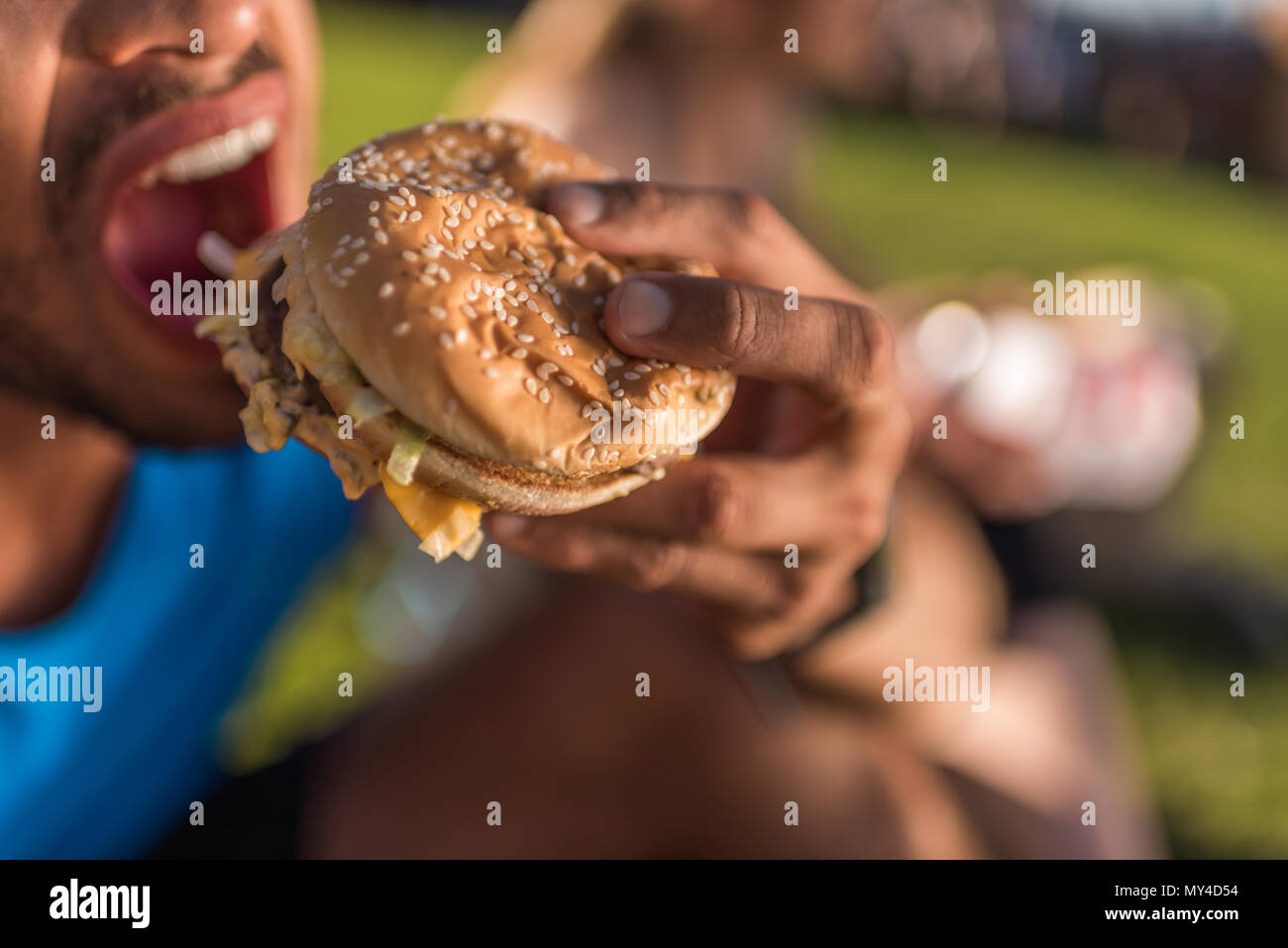 Biting into hamburger hi-res stock photography and images - Alamy
