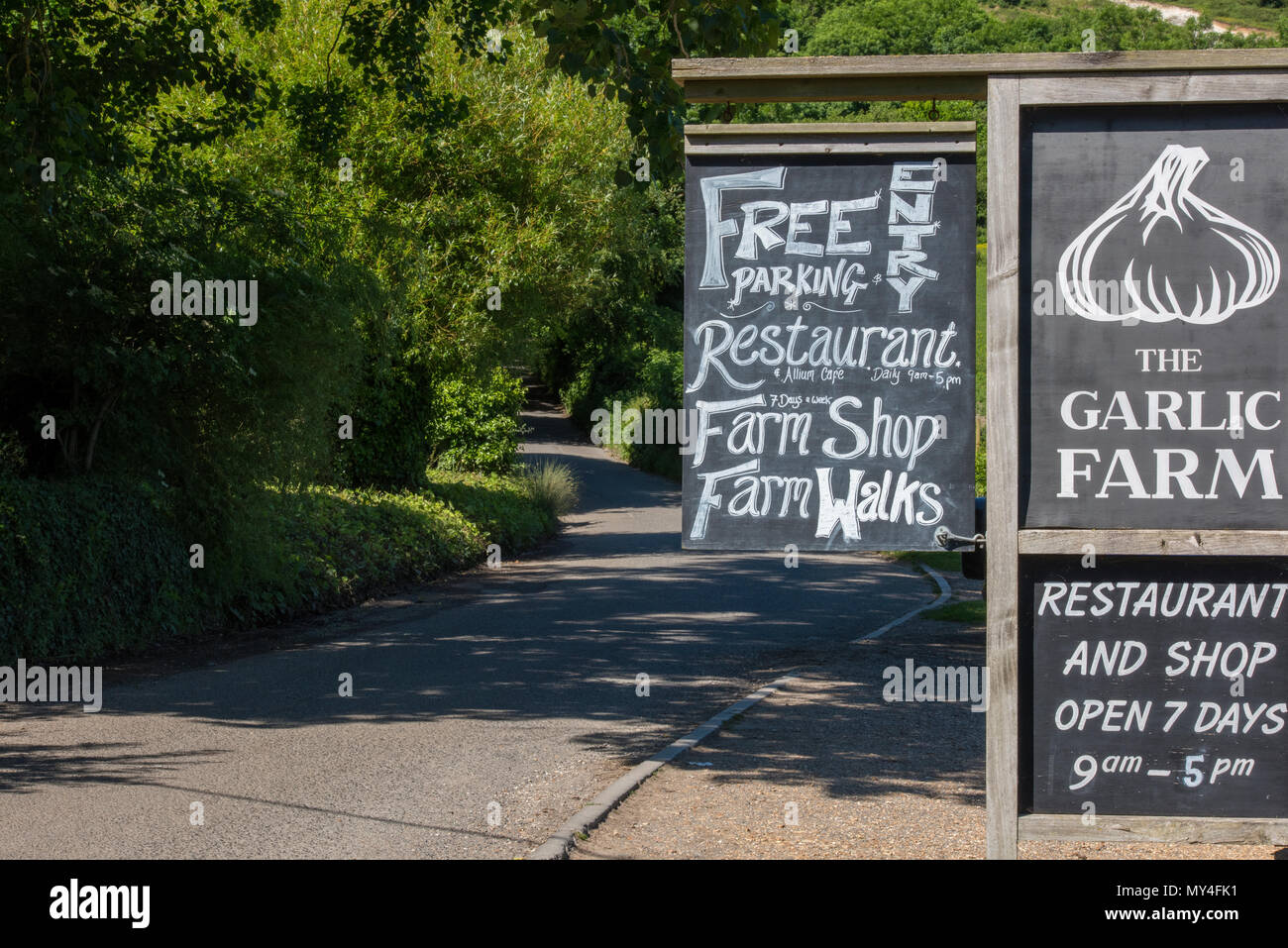 Chalked signs written on boards advertising the garlic farm at new ...