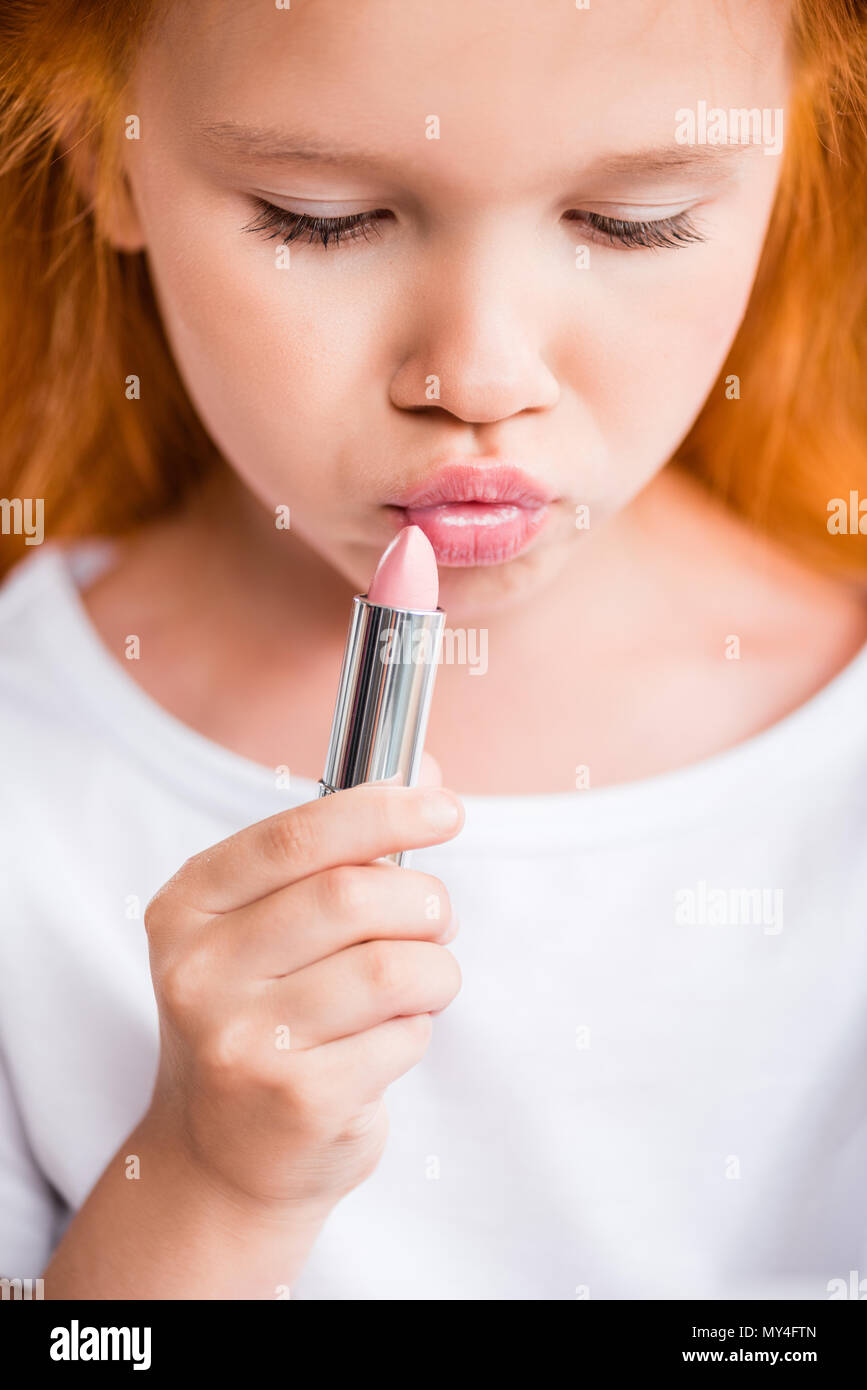 Applying Pink Lipstick
