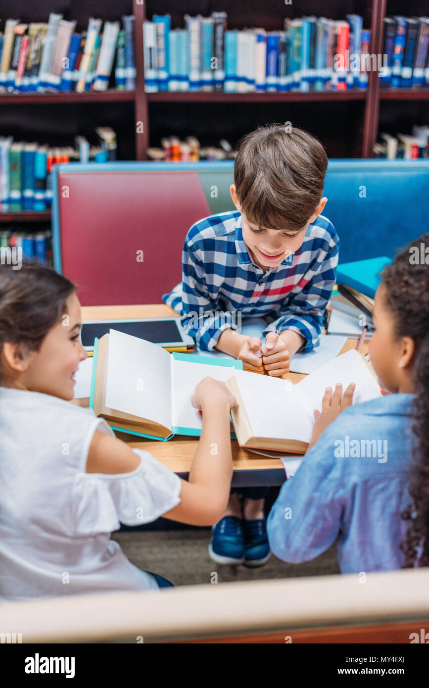 cute little kids reading books in library Stock Photo - Alamy