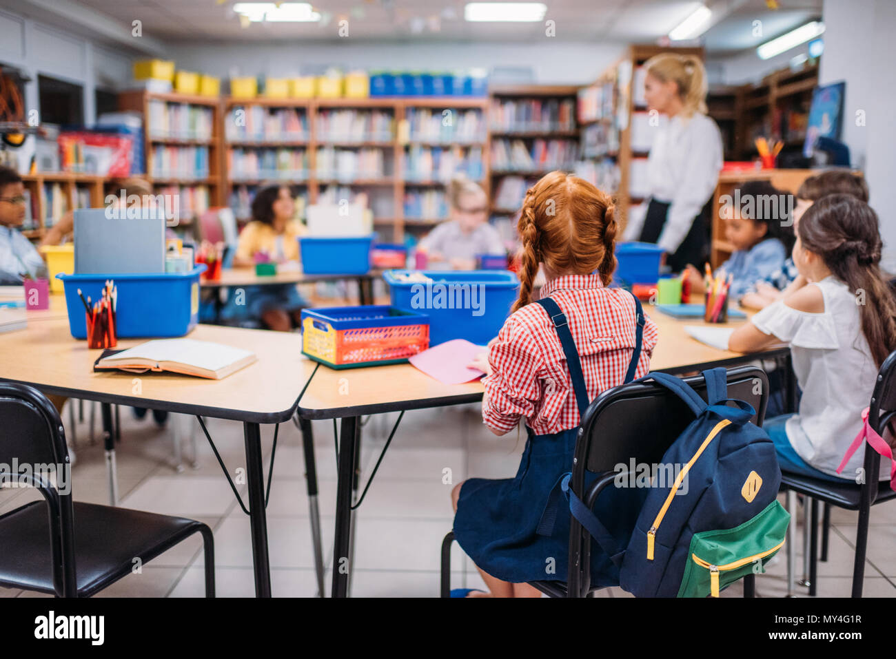 group of little kids having lesson at library Stock Photo - Alamy