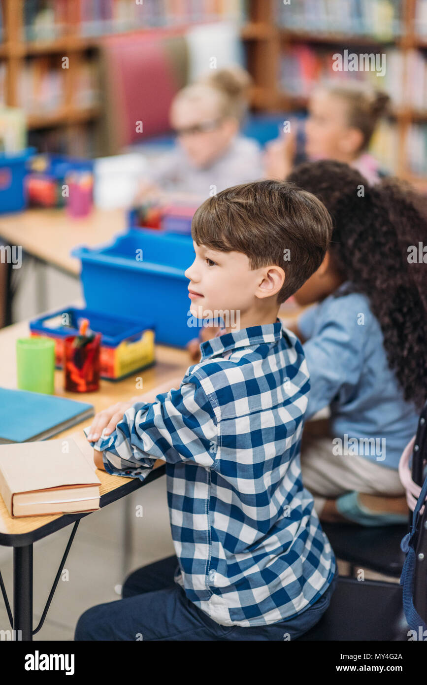 adorable little kids having lesson in library Stock Photo - Alamy