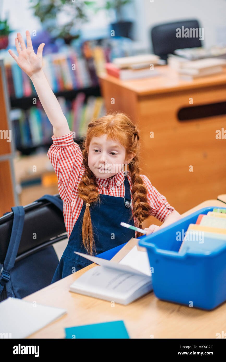 Child raising hand back hi-res stock photography and images - Alamy