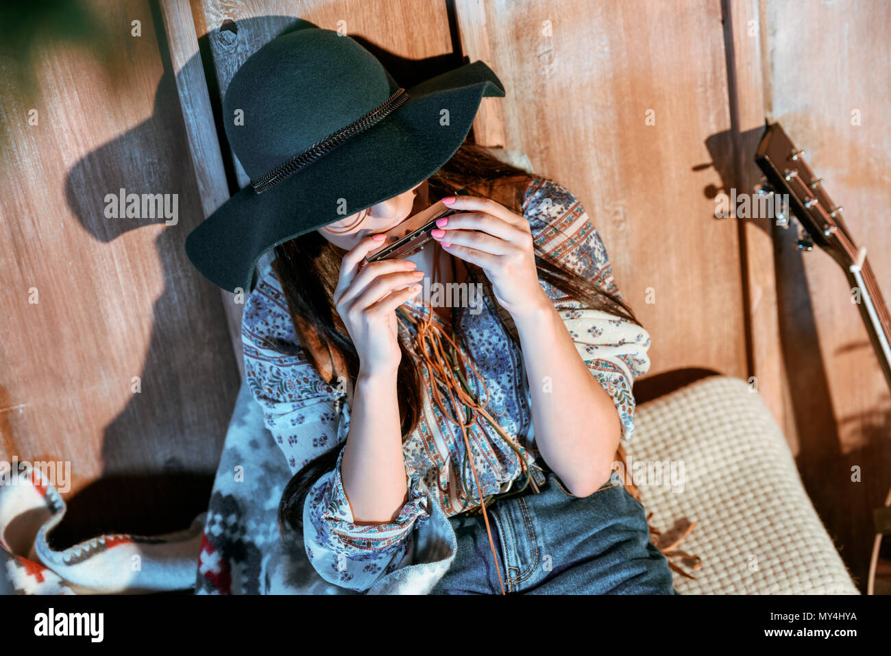 Girl playing harmonica hi-res stock photography and images - Alamy