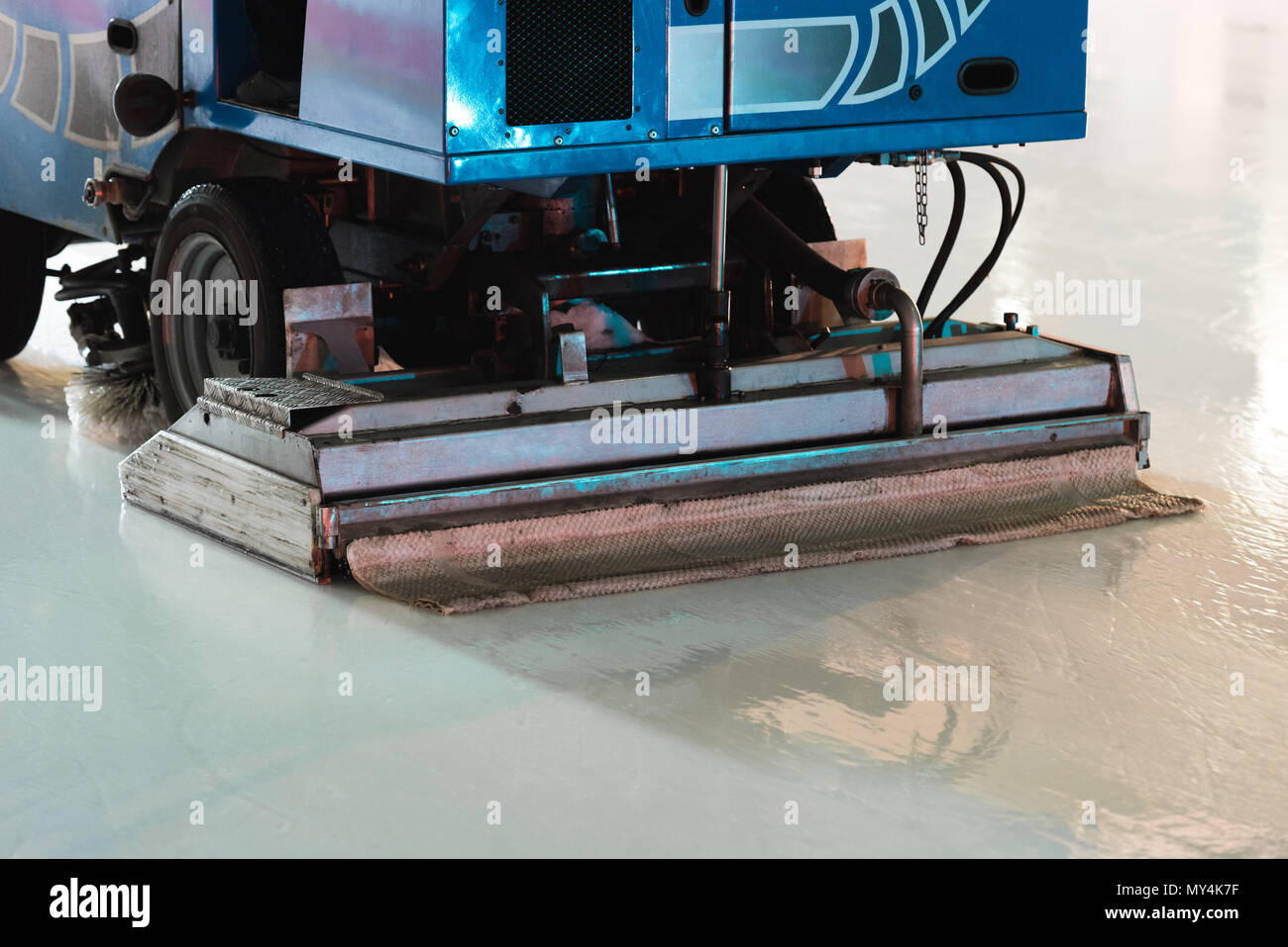Special machine ice harvester cleaning the ice rink Stock Photo - Alamy