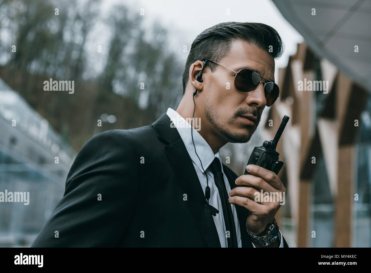 Security guard talking hi-res stock photography and images - Alamy