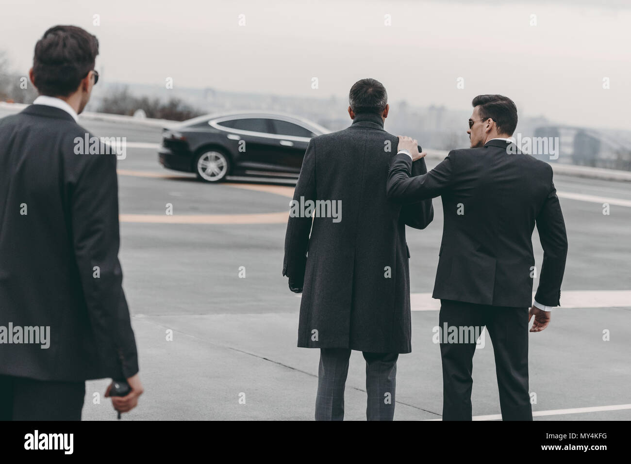 Bodyguards rear view hi-res stock photography and images - Alamy