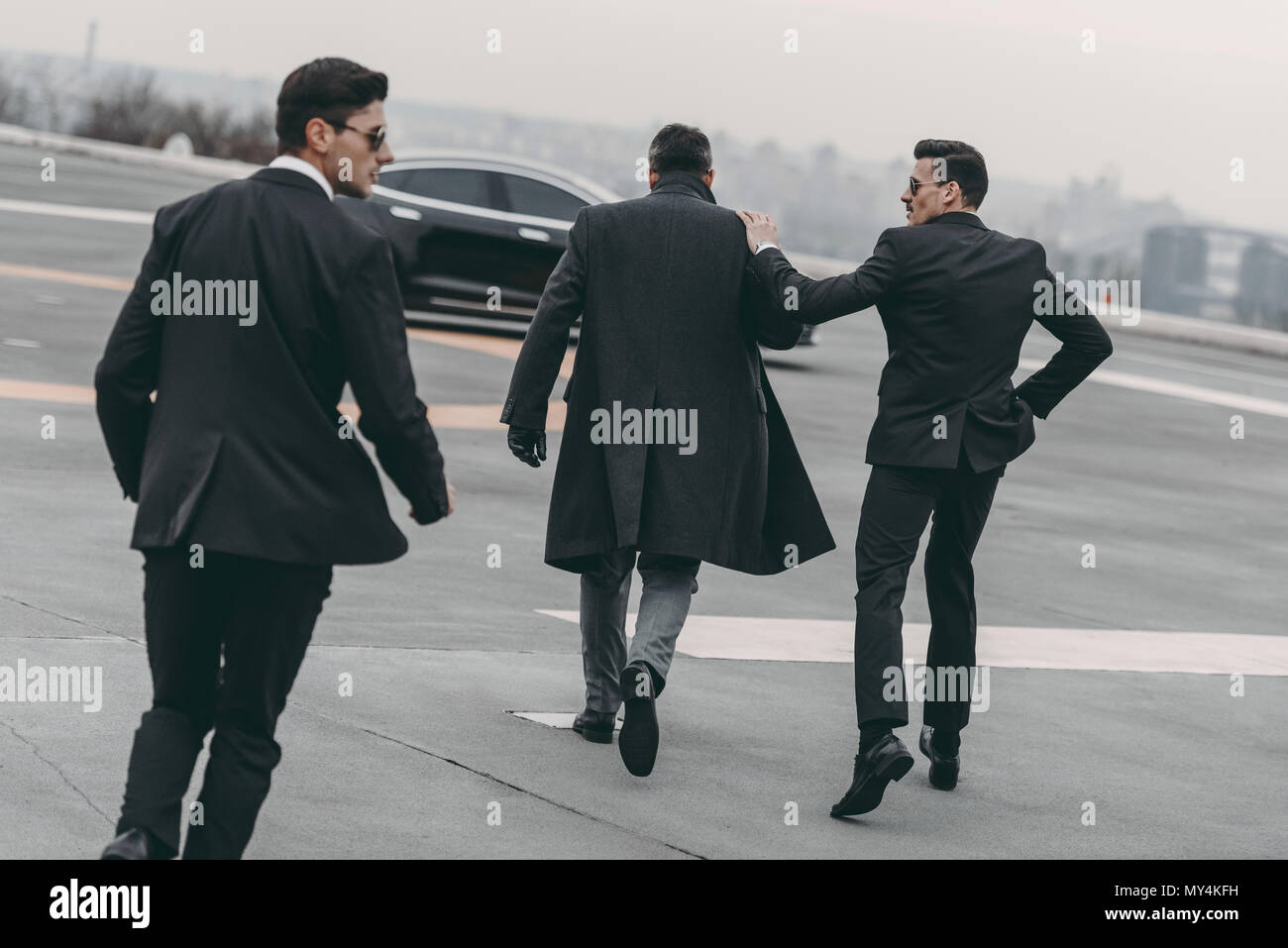 Bodyguards rear view hi-res stock photography and images - Alamy