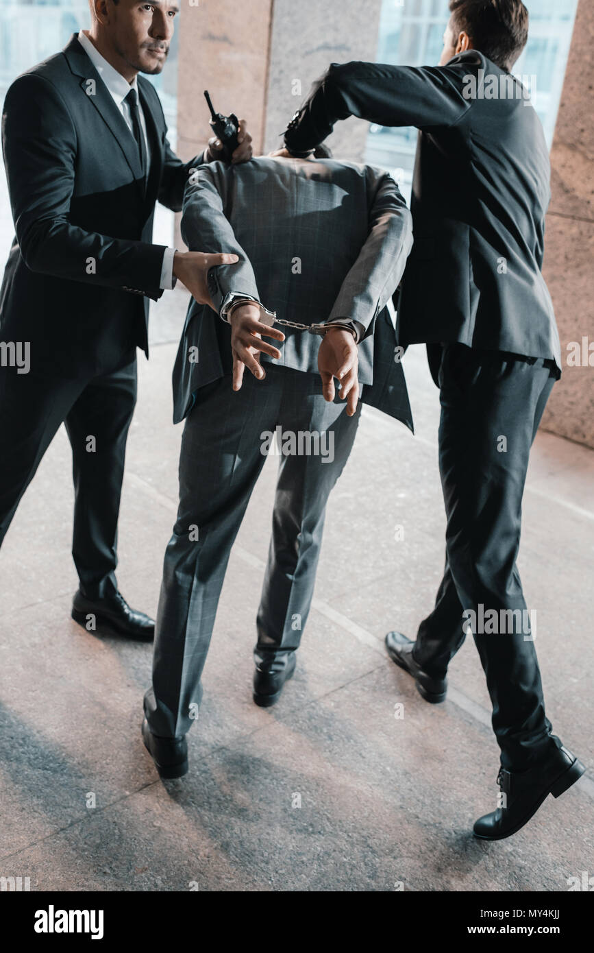 Arresting man handcuffs hi-res stock photography and images - Alamy