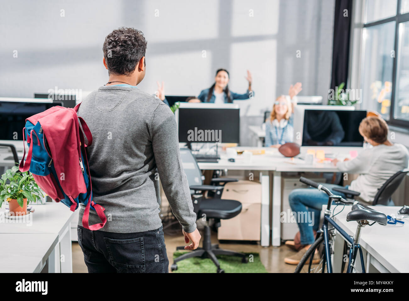 people greetings his colleague in modern office Stock Photo - Alamy