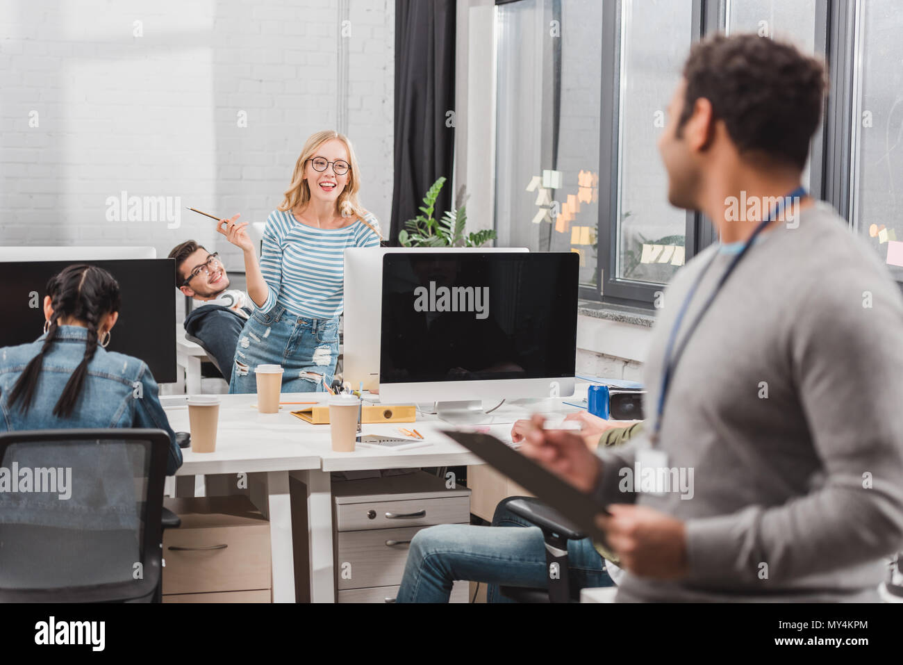 man with name tag and planchette at modern office Stock Photo - Alamy