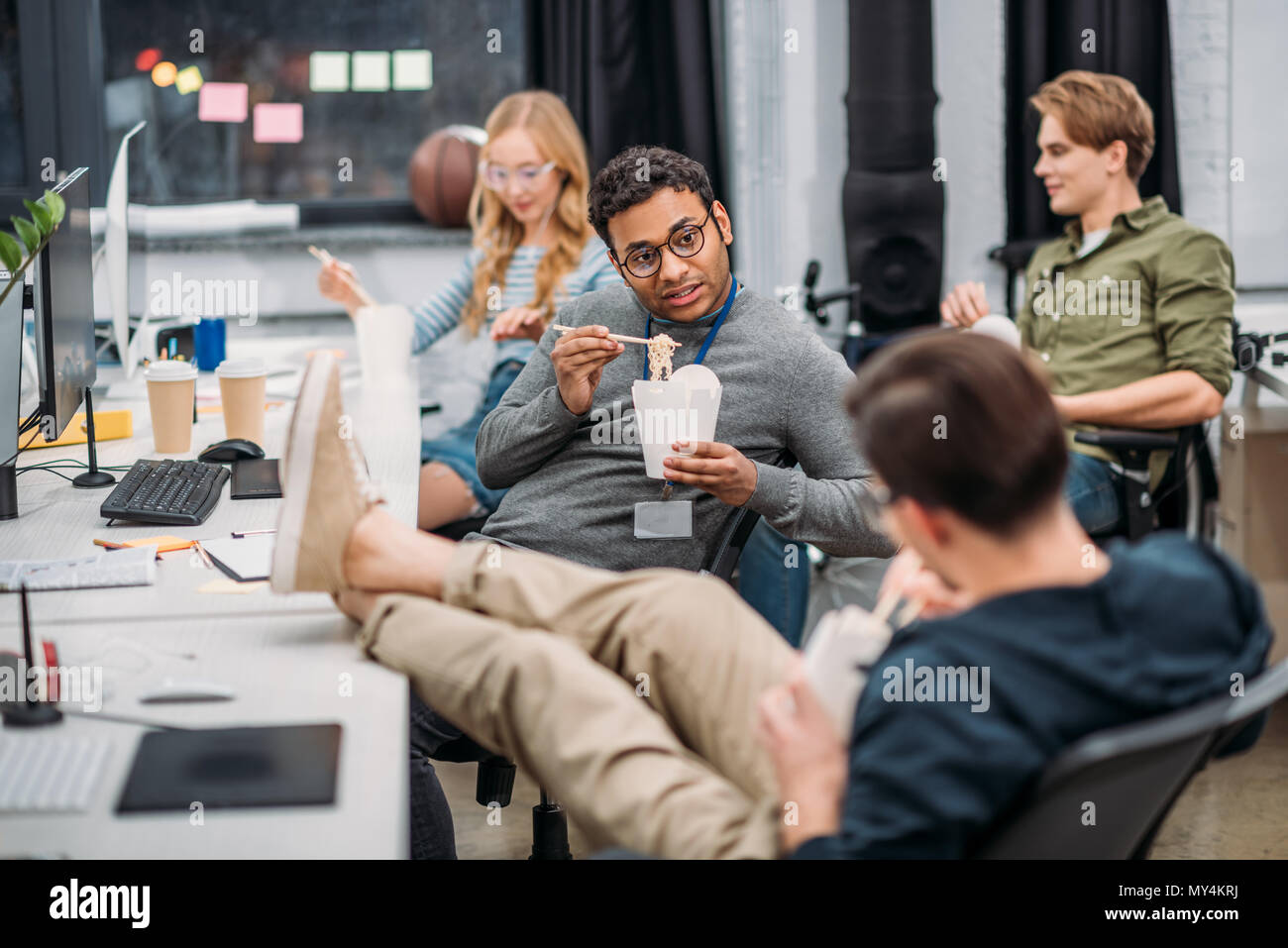 multicultural people having lunch break at modern office Stock Photo ...