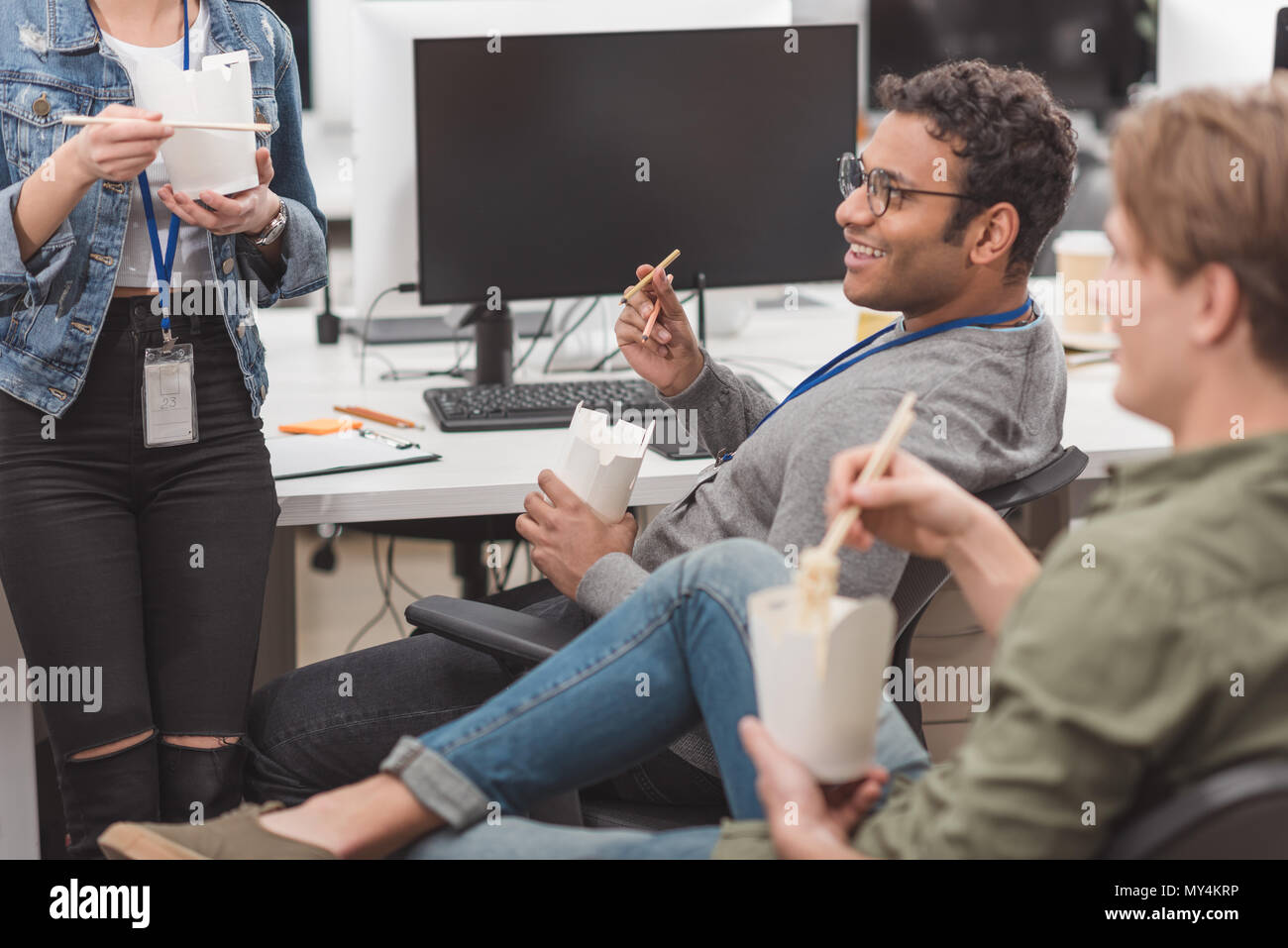happy multiethnic workers eating thai food at modern office Stock Photo ...